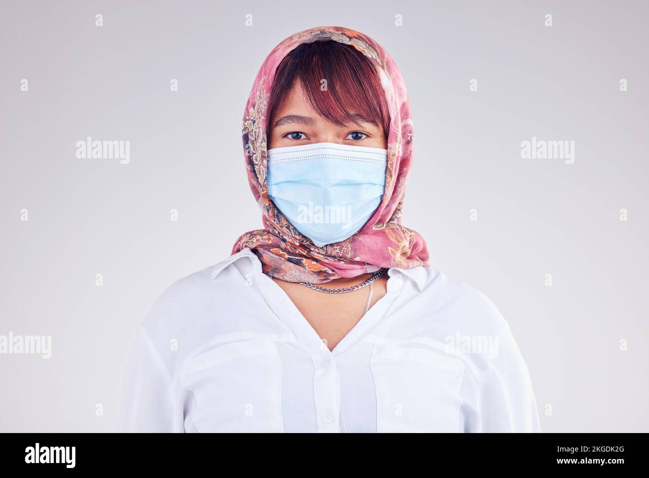 Covid, muslim and mask with a woman in studio on a gray background for ...