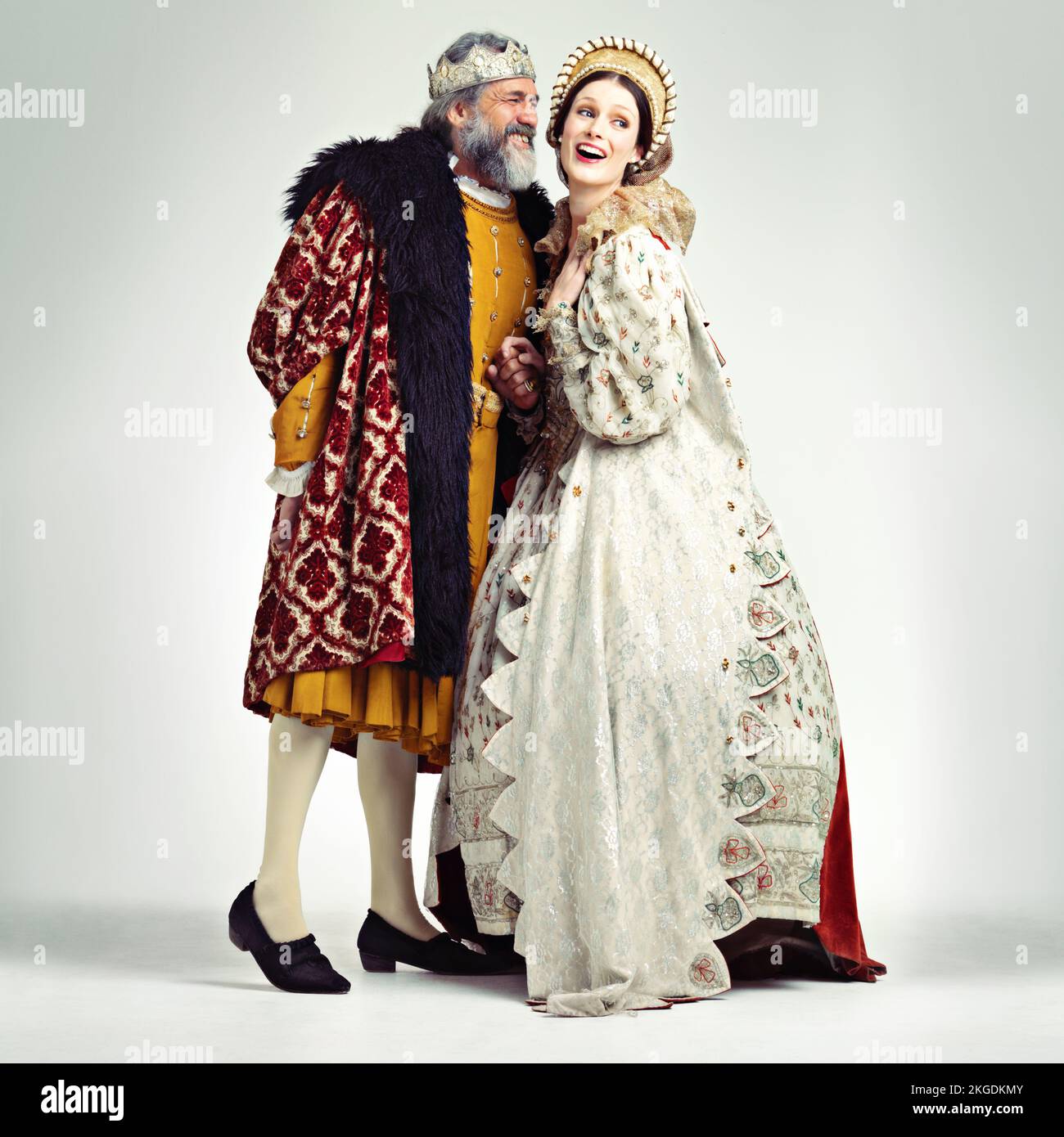 Such humorous words mlord. Studio shot of a king and queen laughing ...