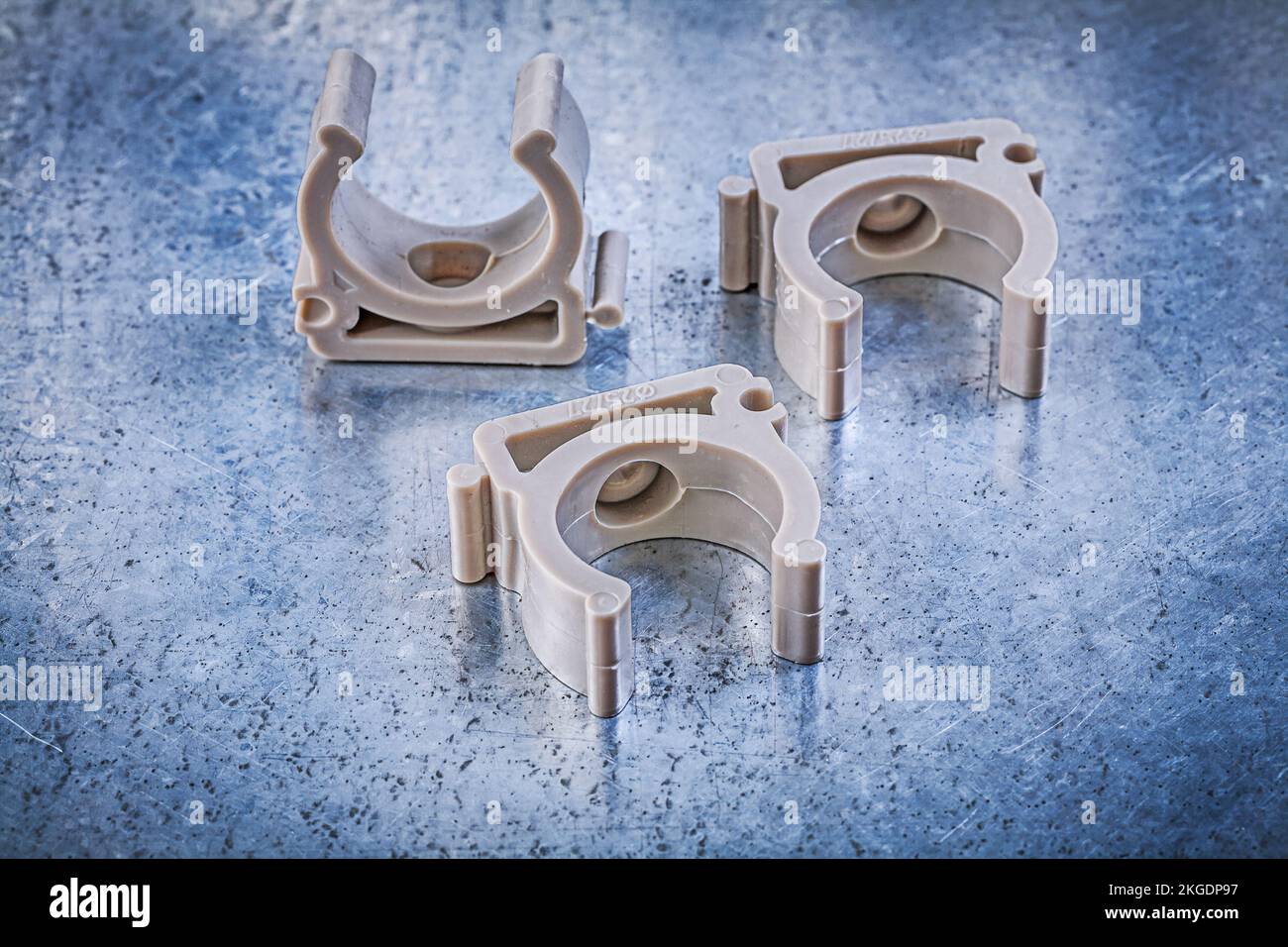 Collection of water pipe clamps on metallic background construction ...