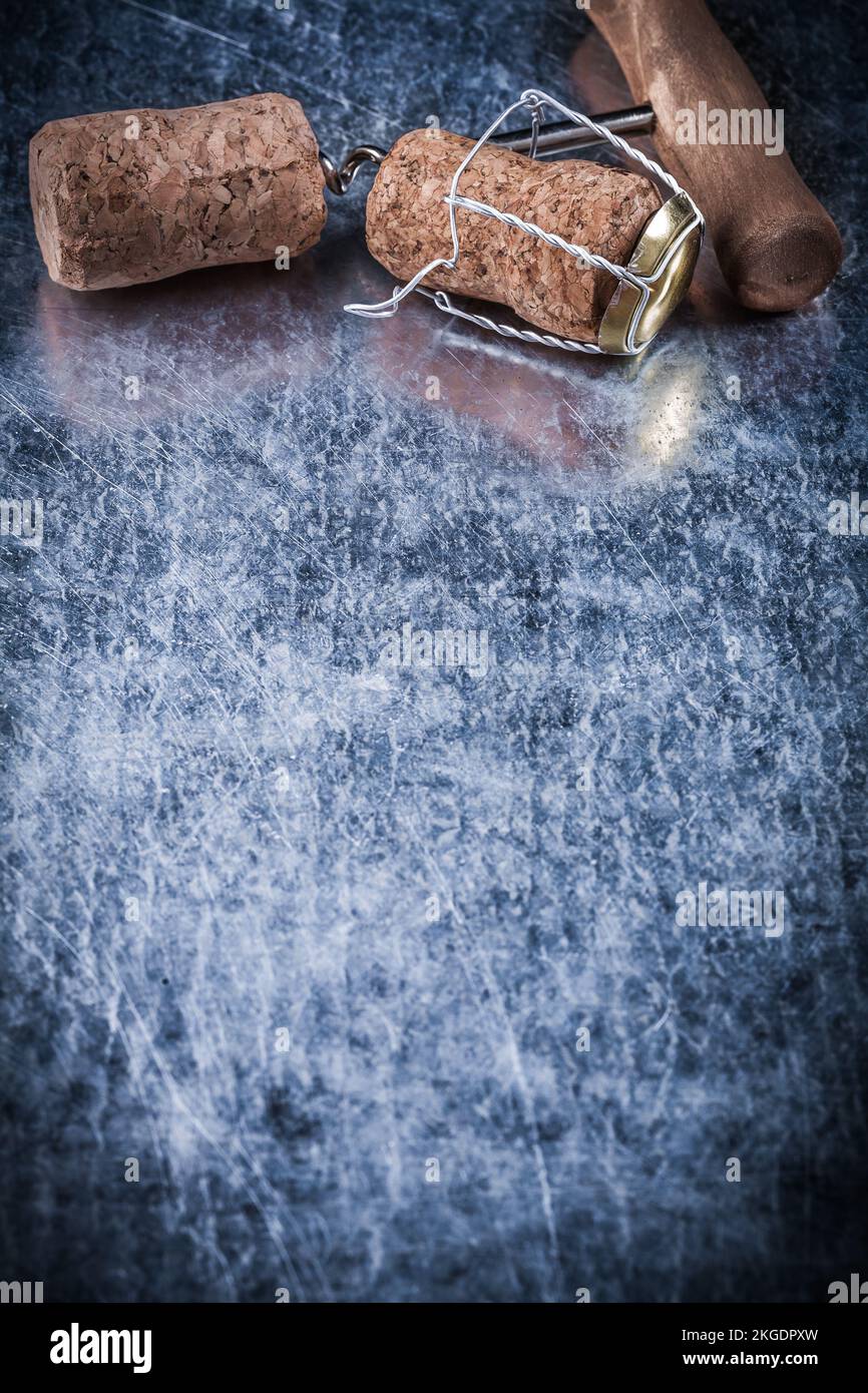 Composition of champagne corks twisted wire corkscrew on metallic ...