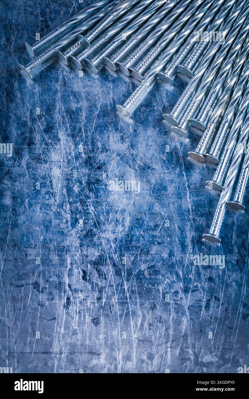 Composition of metal construction nails on scratched metallic ...