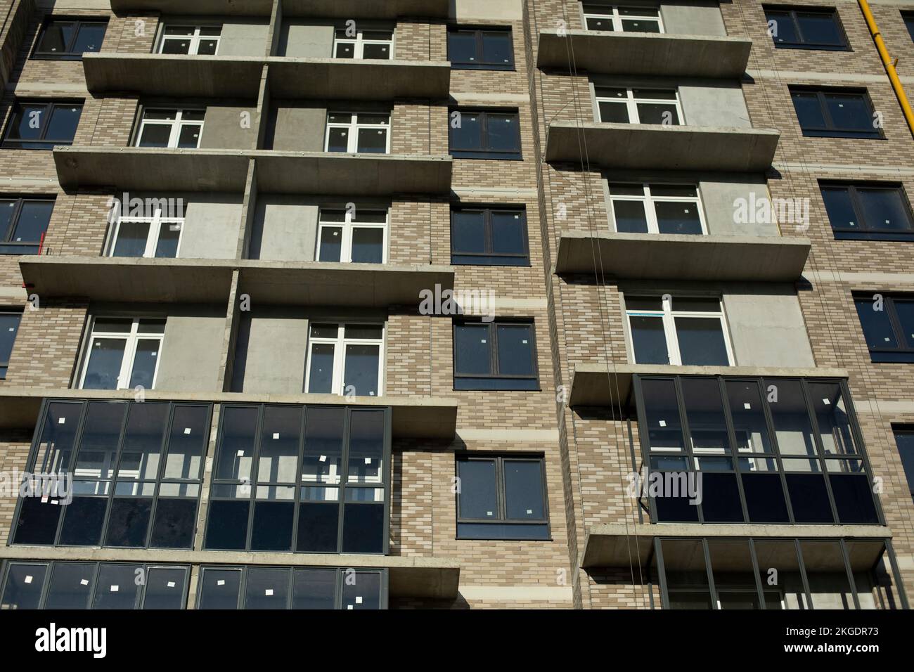Building with windows in city. High house. Many floors in building ...