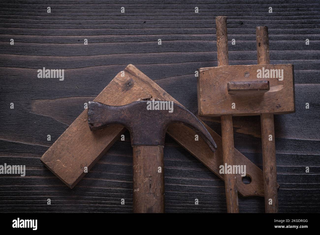 Composition of vintage wooden claw hammer square ruler and marking gage ...