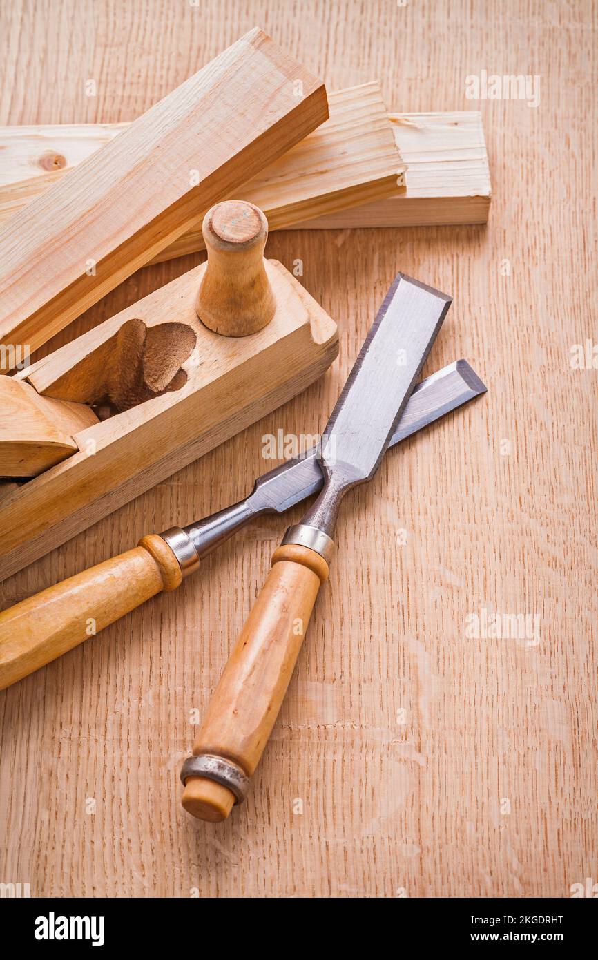 compostion of woodworkers plane and carpentry chisel wooden planks on ...
