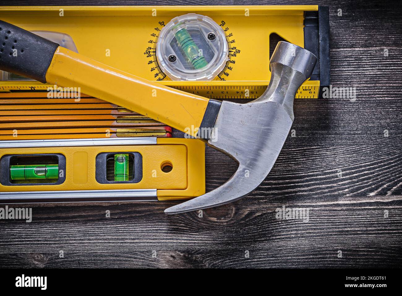 Construction level wooden meter claw hammer on wooden surface Stock ...