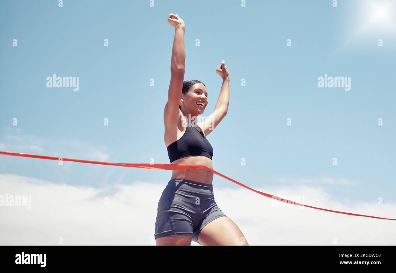 Fitness, winner and sports woman running a race and winning first place ...