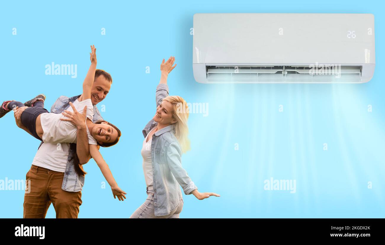 Happy Family Under Air Conditioning Stock Photo - Alamy
