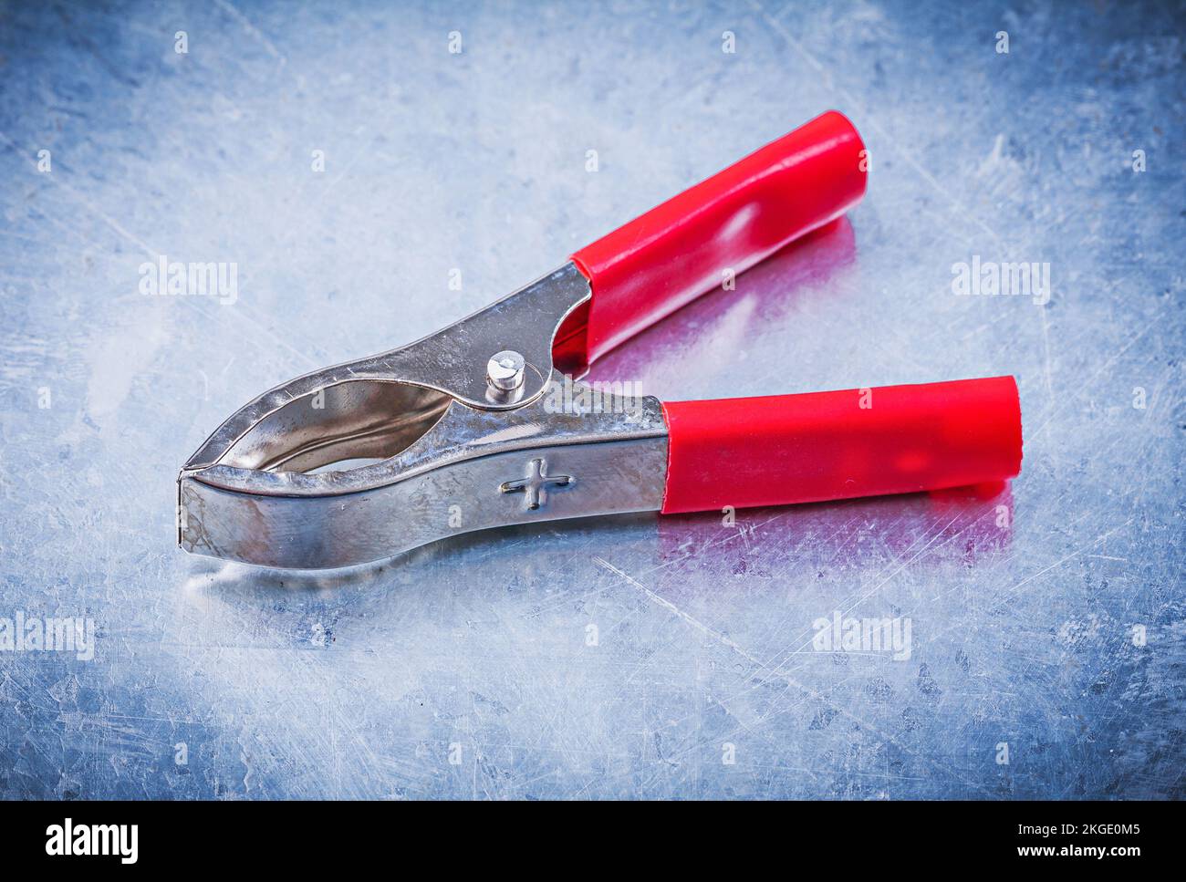 Electric crocodile plug on scratched metallic background Stock Photo ...