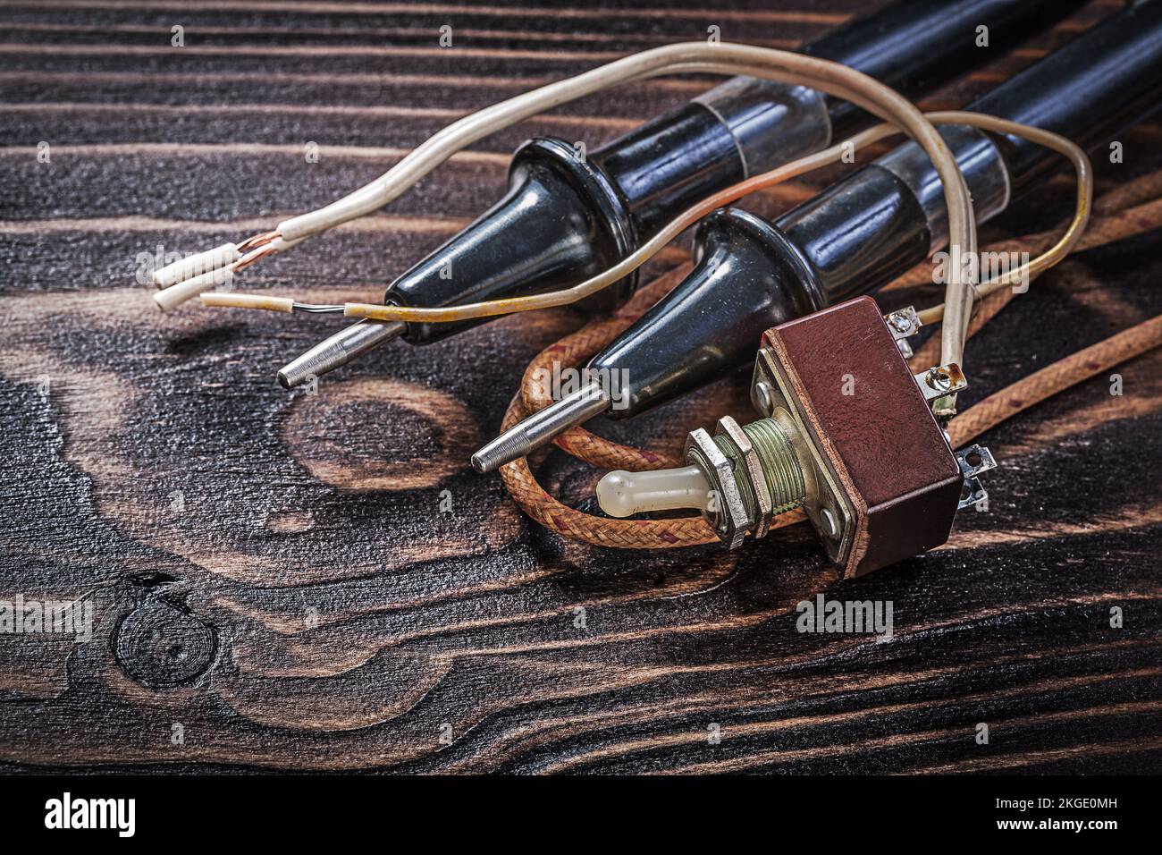 Electric toggle switch vintage electrical tester on wooden board ...