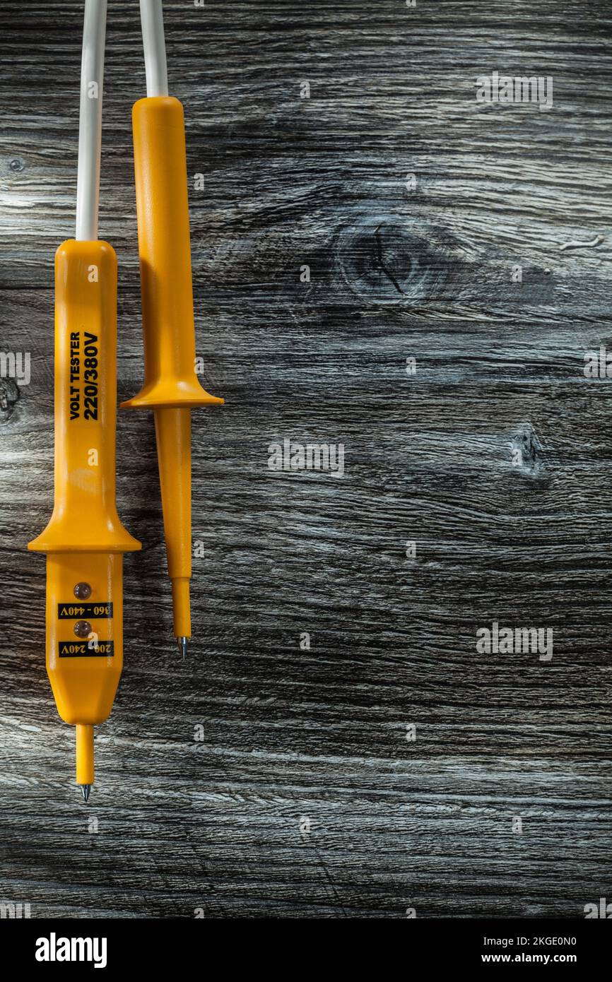 Electric tester on wooden board Stock Photo - Alamy