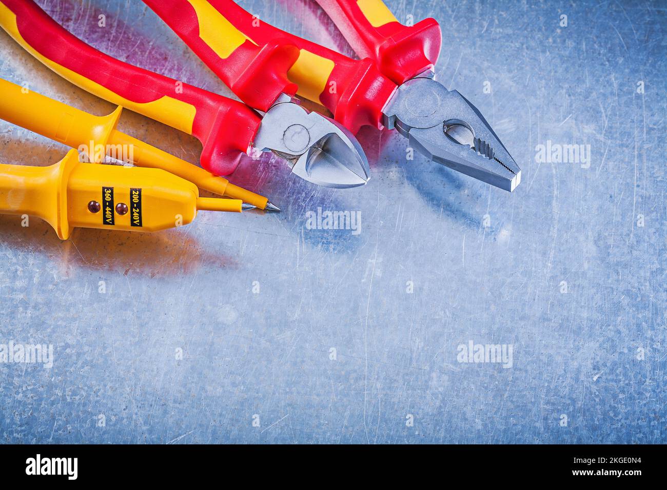 Electric tester pliers nippers on metallic background electricity ...