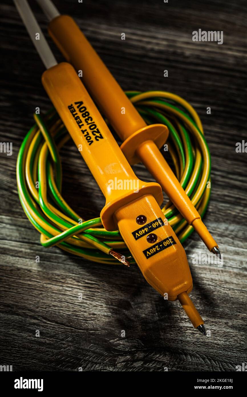 Electrical cable tester on wooden board Stock Photo - Alamy