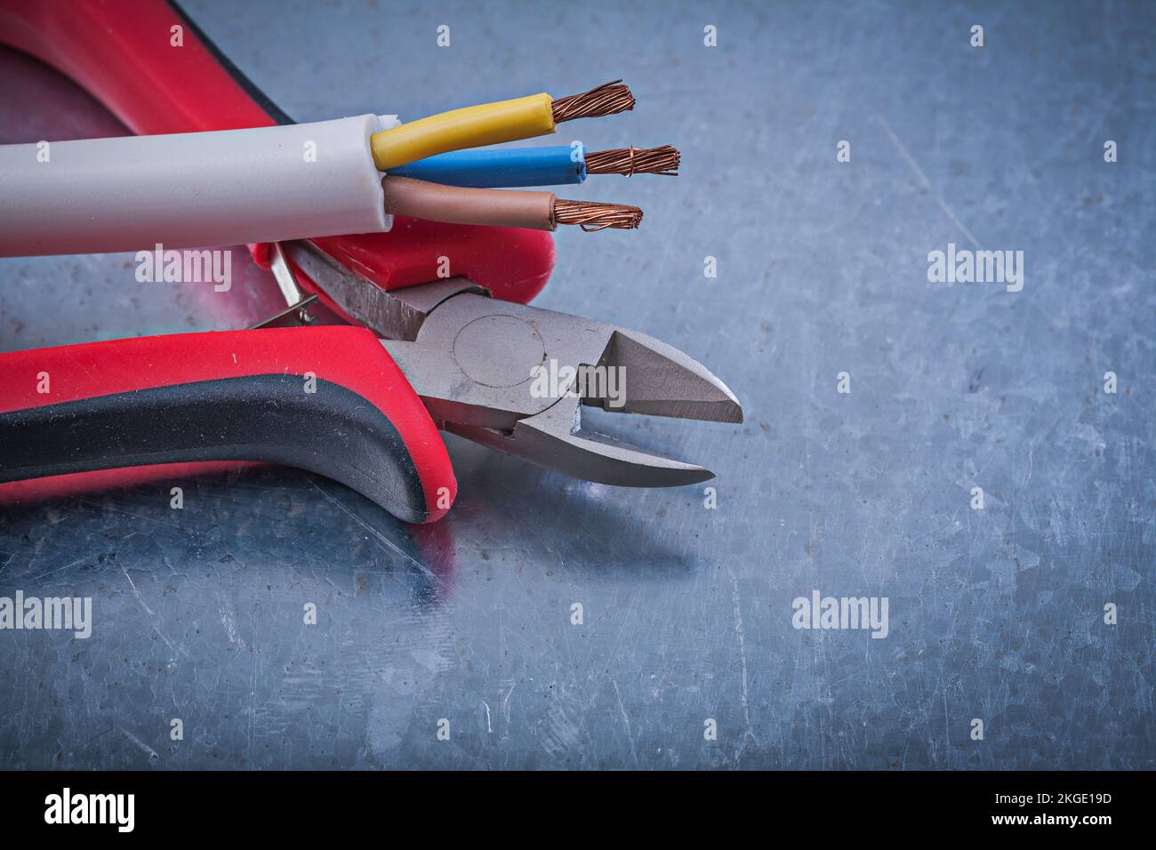 Electrical cables wires nippers on metallic background construction ...