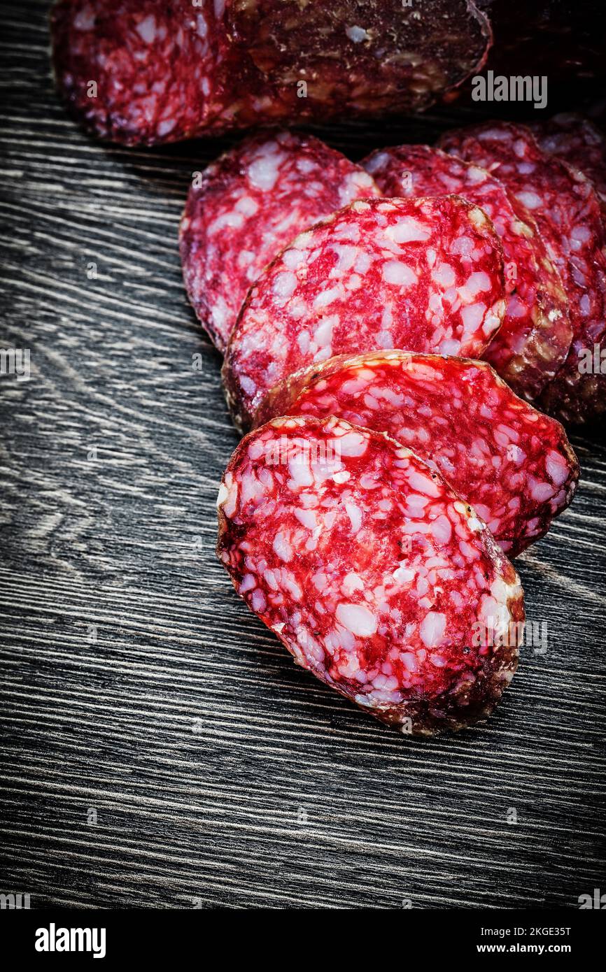 Fresh chopped salami on wooden board food concept Stock Photo - Alamy