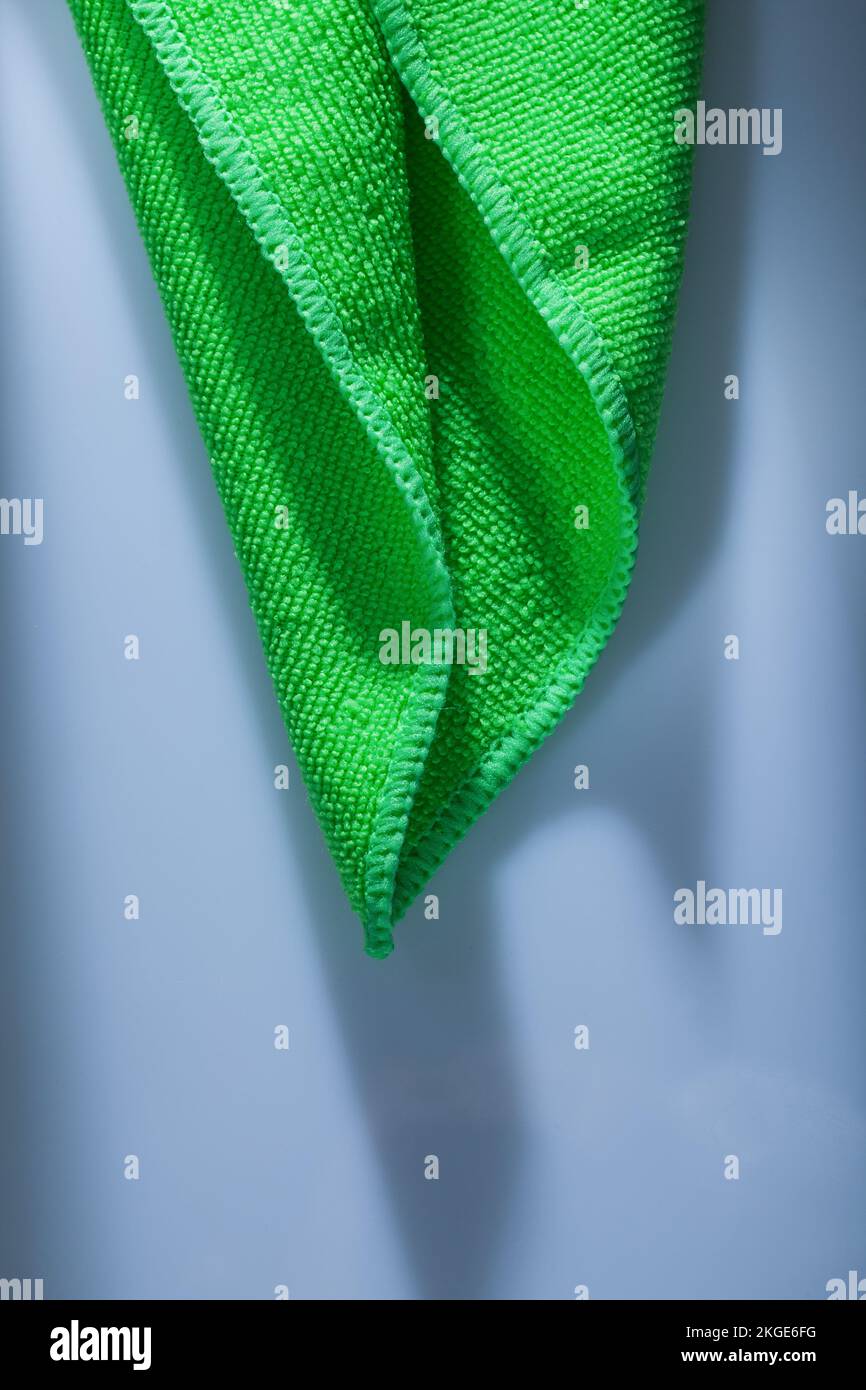 Green kitchen dishwashing cloth on white background Stock Photo - Alamy