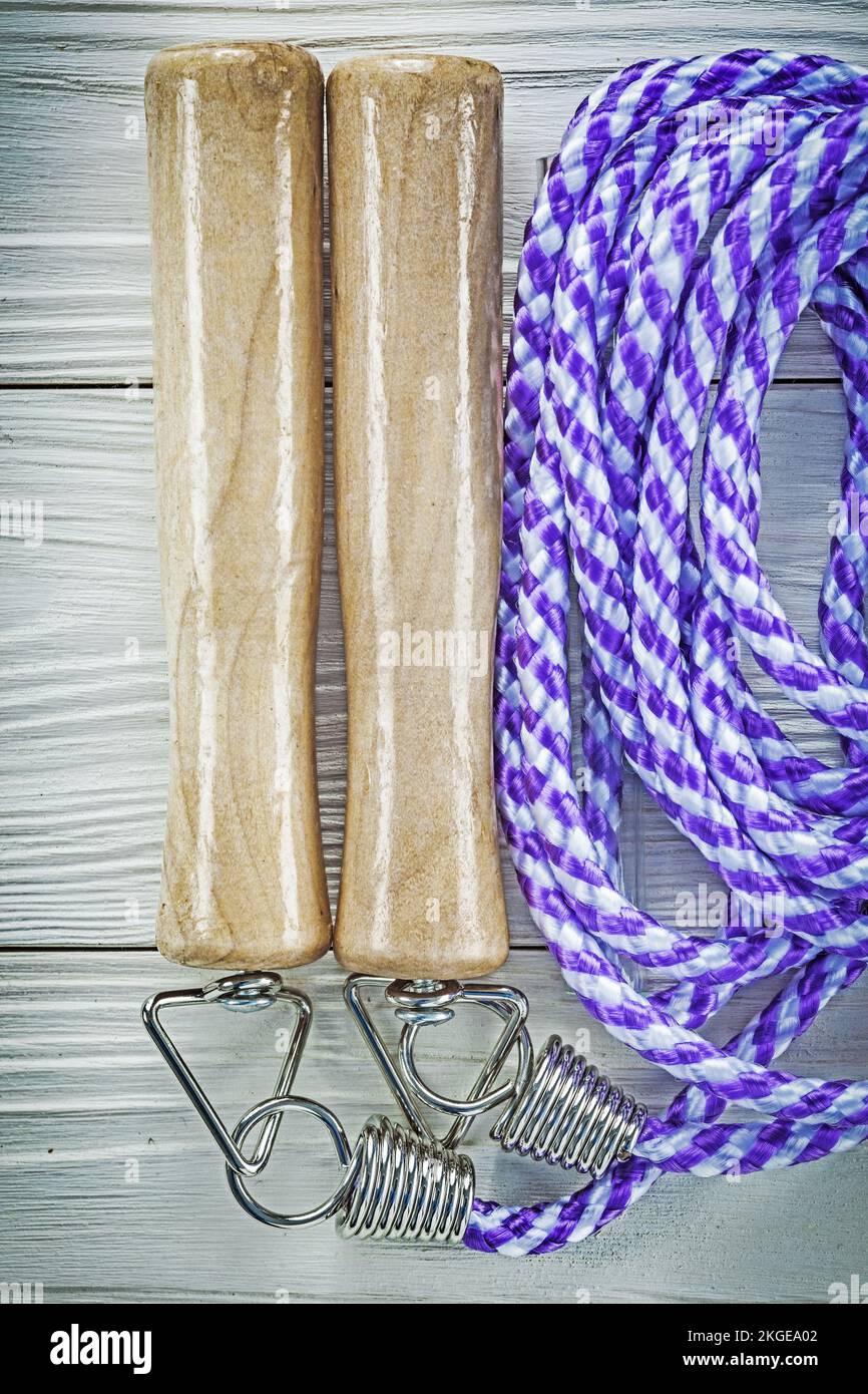 Jump rope with wooden handles on wood board fitness concept Stock Photo ...
