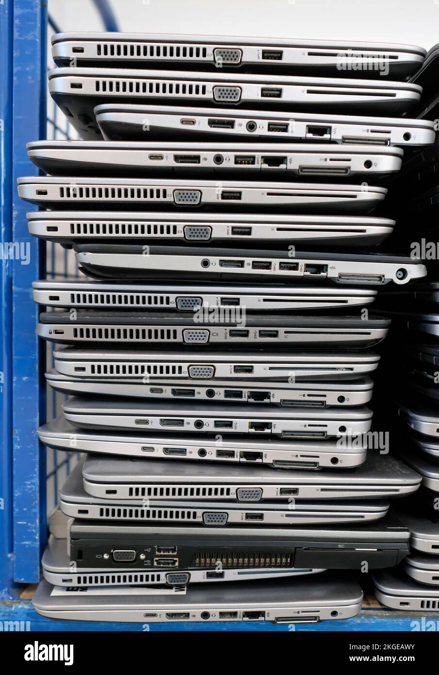 Big stacks of discarded laptops, notebooks on a trolley Stock Photo - Alamy