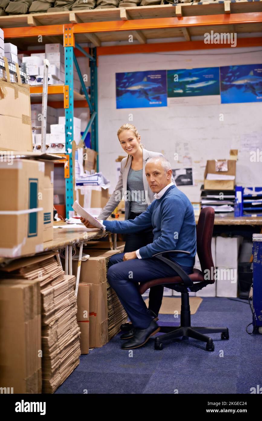 We ship 247. managers at work supervising a shipping and distribution ...