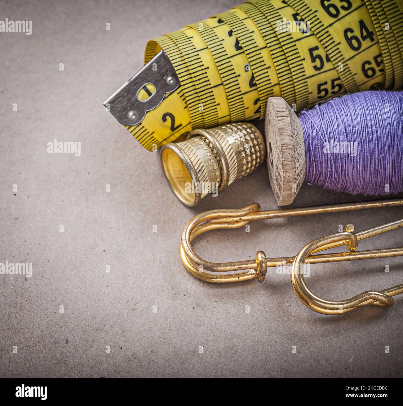 Measuring flexible ruler thread spool safety pins thimbles Stock Photo ...