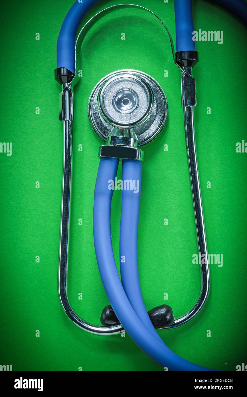 Medical stethoscope on green background top view Stock Photo - Alamy