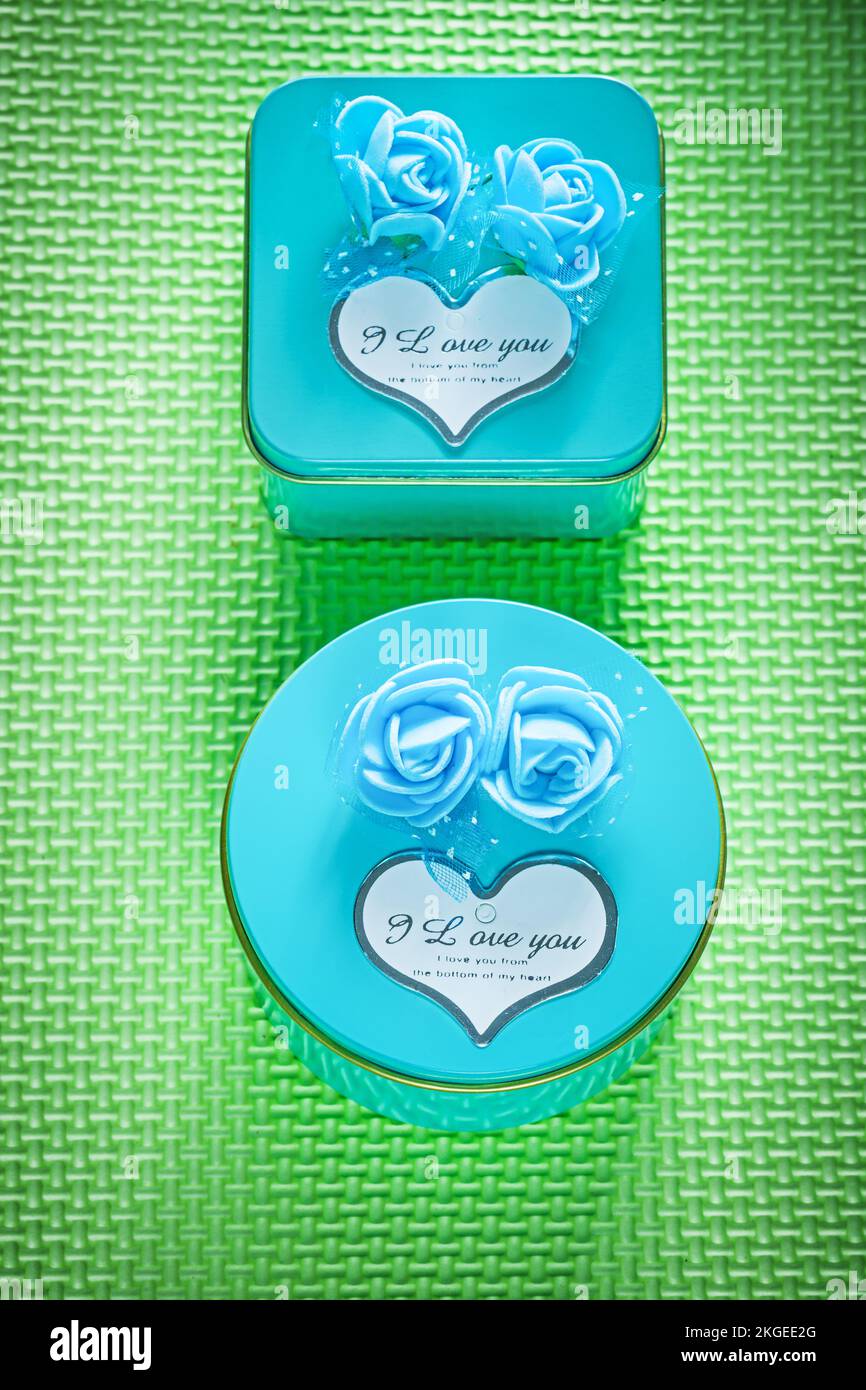 Metal blue present boxes on green background top view celebrations ...