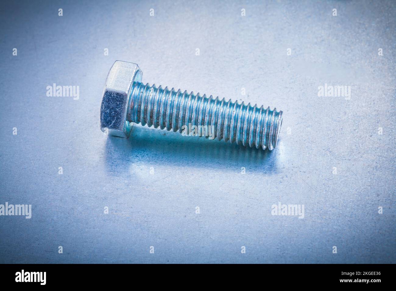Metal construction screw bolt on metallic background repairing concept ...