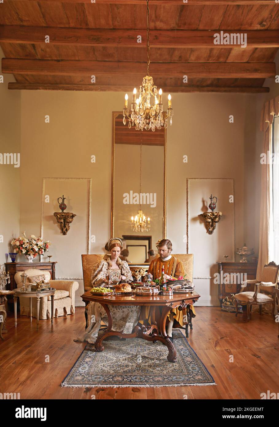 Its a highborn life for us. a noble couple eating together Stock Photo ...