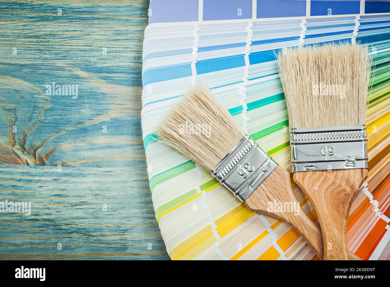 Multi colored color sampler paint brushes on wooden board construction ...