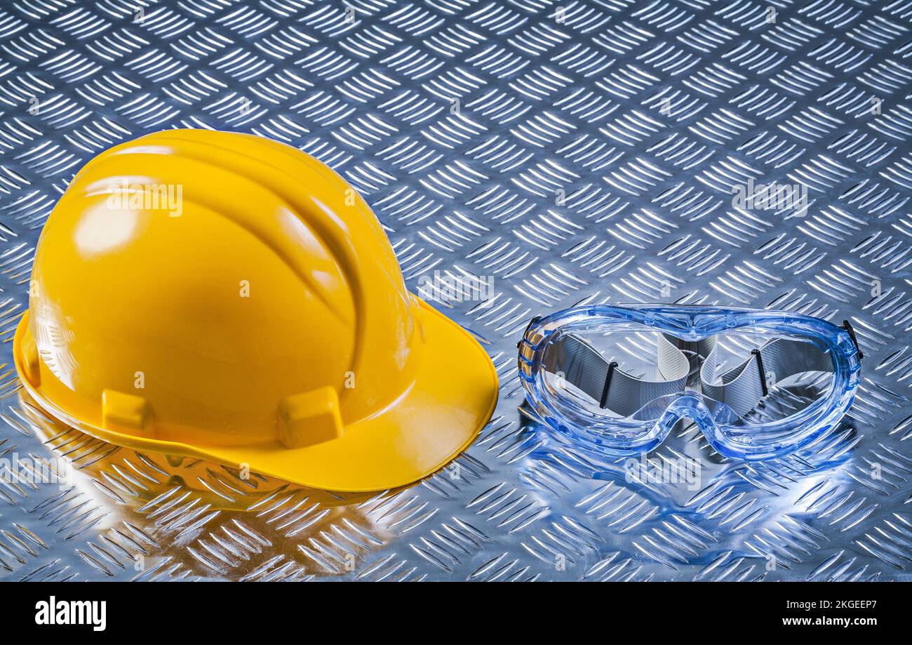 Multiple-purpose safety spectacles building helmet on corrugated metal ...