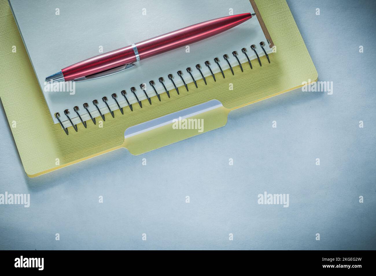 Notepad paper folder biro pen Stock Photo - Alamy