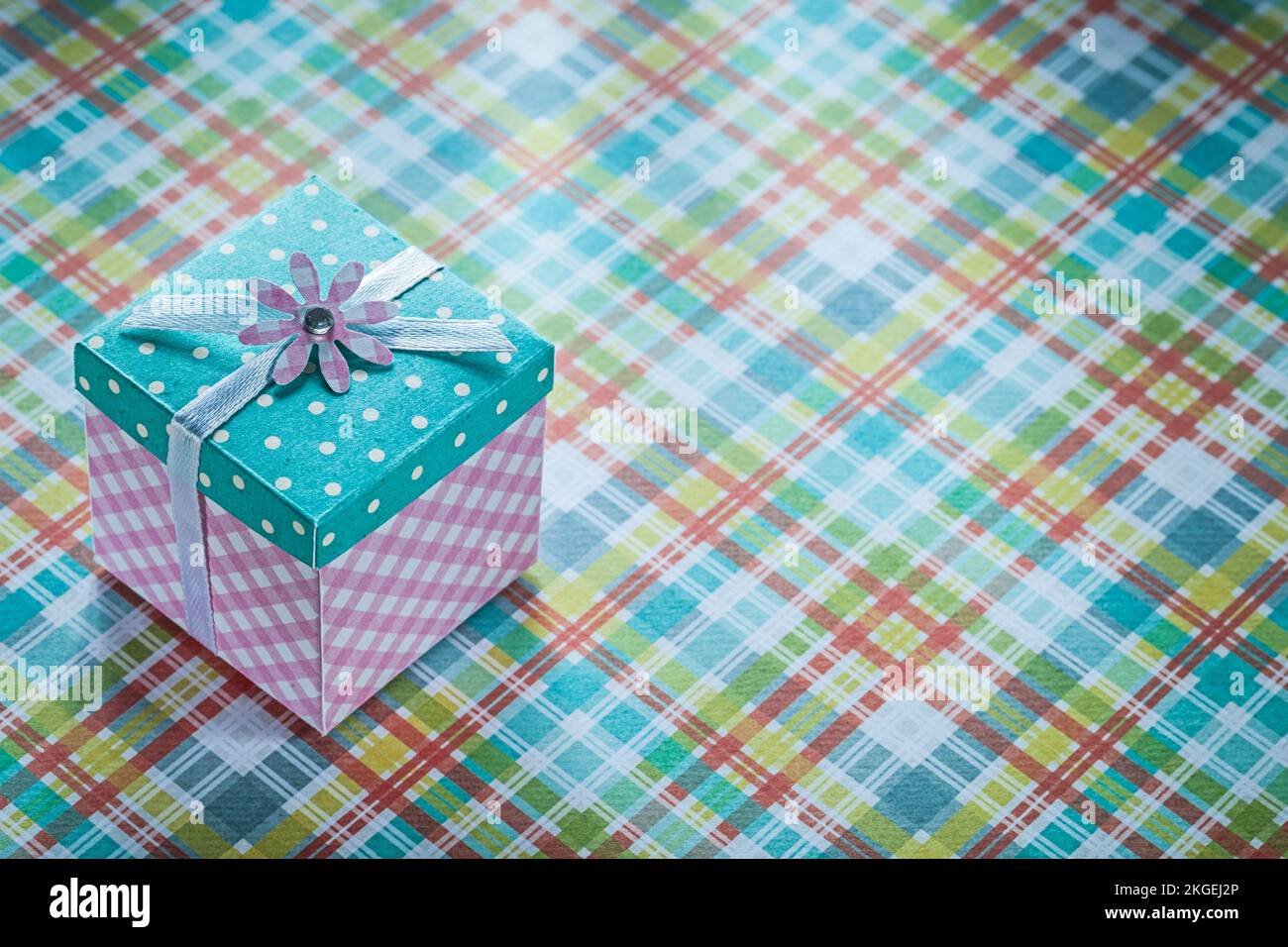 Packed gift box on checked textile celebrations concept Stock Photo - Alamy