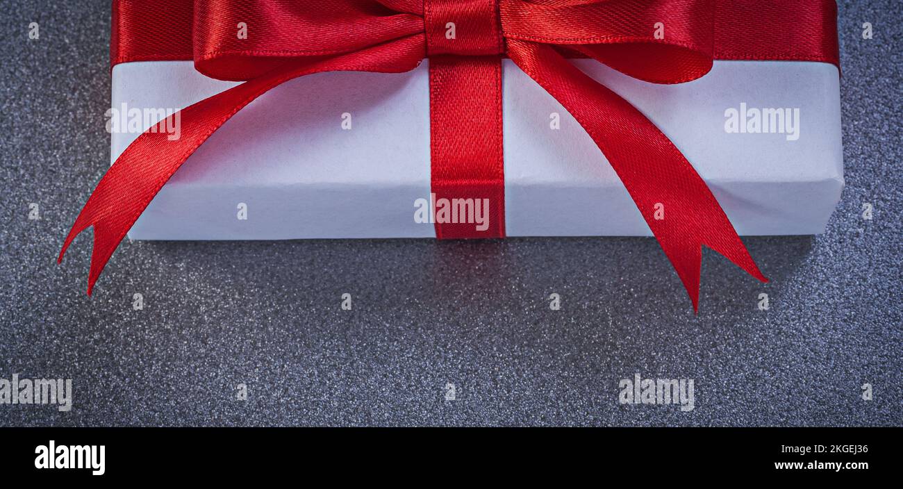 Packed present box on grey surface holidays concept Stock Photo - Alamy