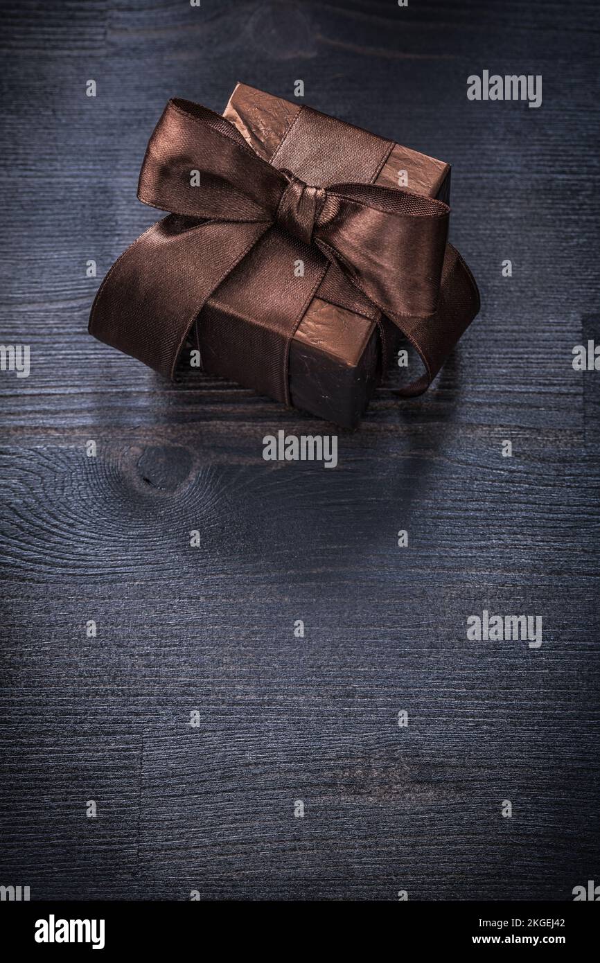 Packed present box glittery paper on wood board holiday concept Stock ...