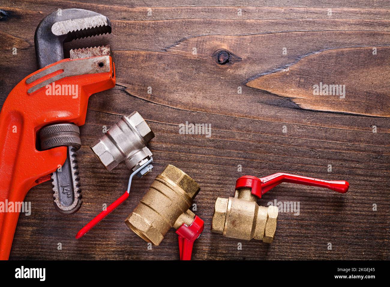 organized copyspace plumbers fixtures and monkey wrench on vintage ...