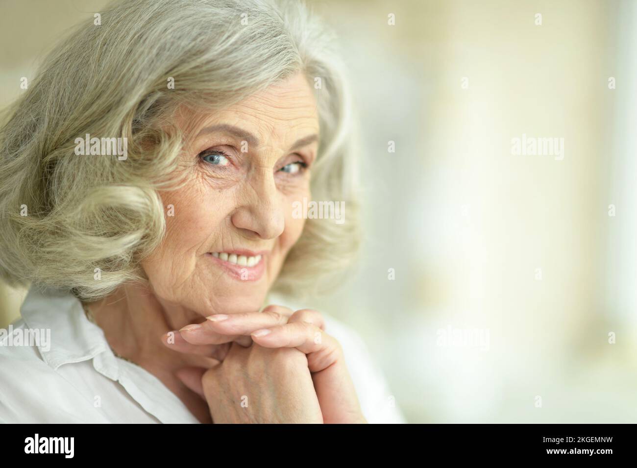 Portrait of smiling senior woman Stock Photo - Alamy