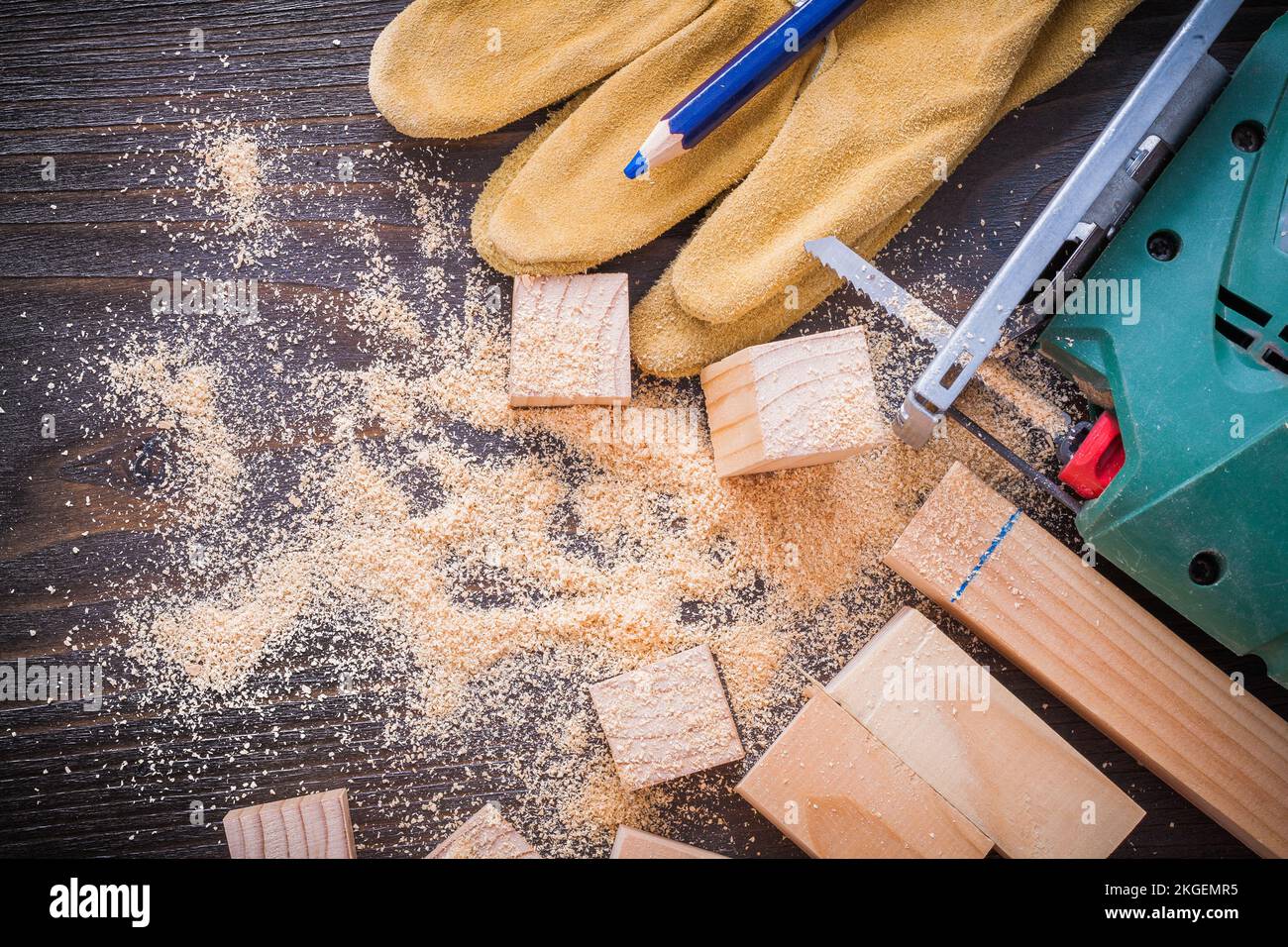 Pencil electric jigsaw sawdust leather protective gloves and wooden ...