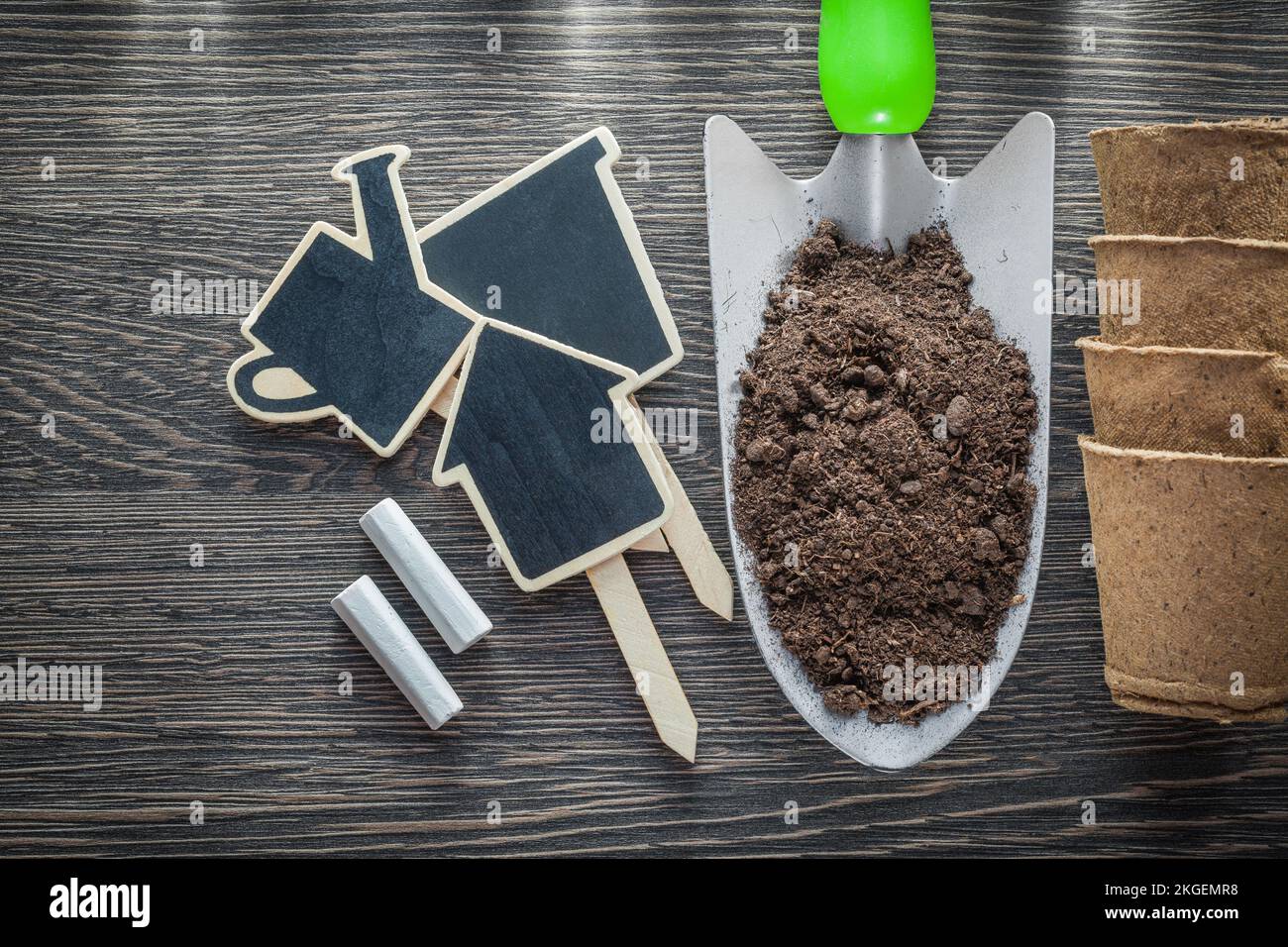 Peat pots hand spade soil chalkboard sign tags on wooden board Stock ...