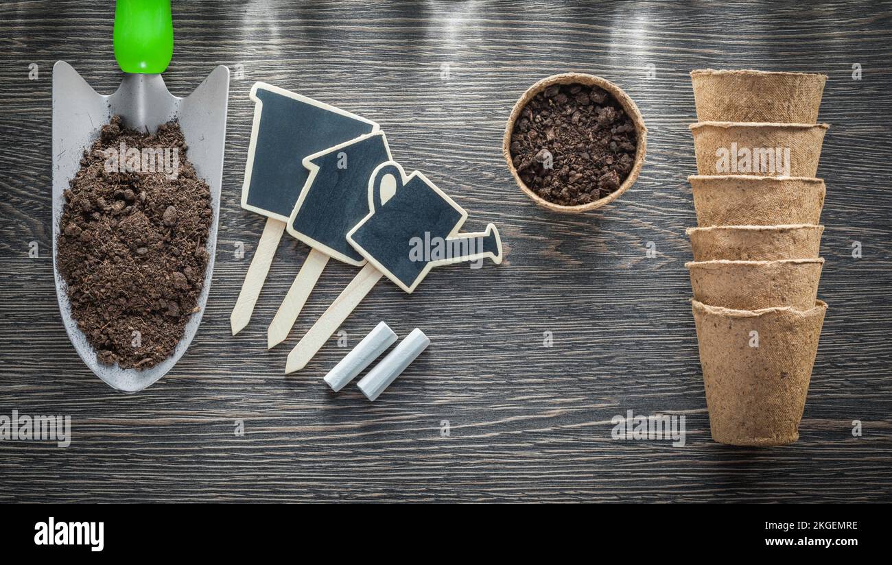 Peat glasses hand spade soil chalkboard sign tags on wooden board Stock ...