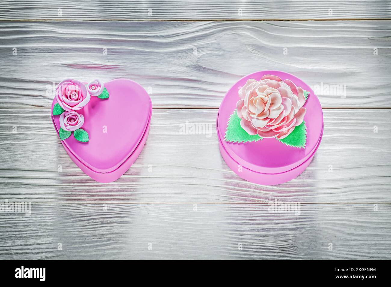 Pink metal gift boxes on wooden board celebrations concept Stock Photo ...