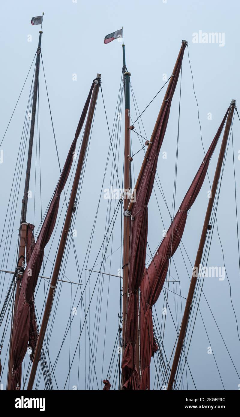 Masts, rigging, flags, and furled sails on a sailing barge Stock Photo ...