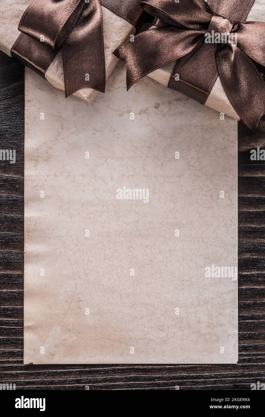 Present boxes with tied ribbons paper vertical view holiday concept ...