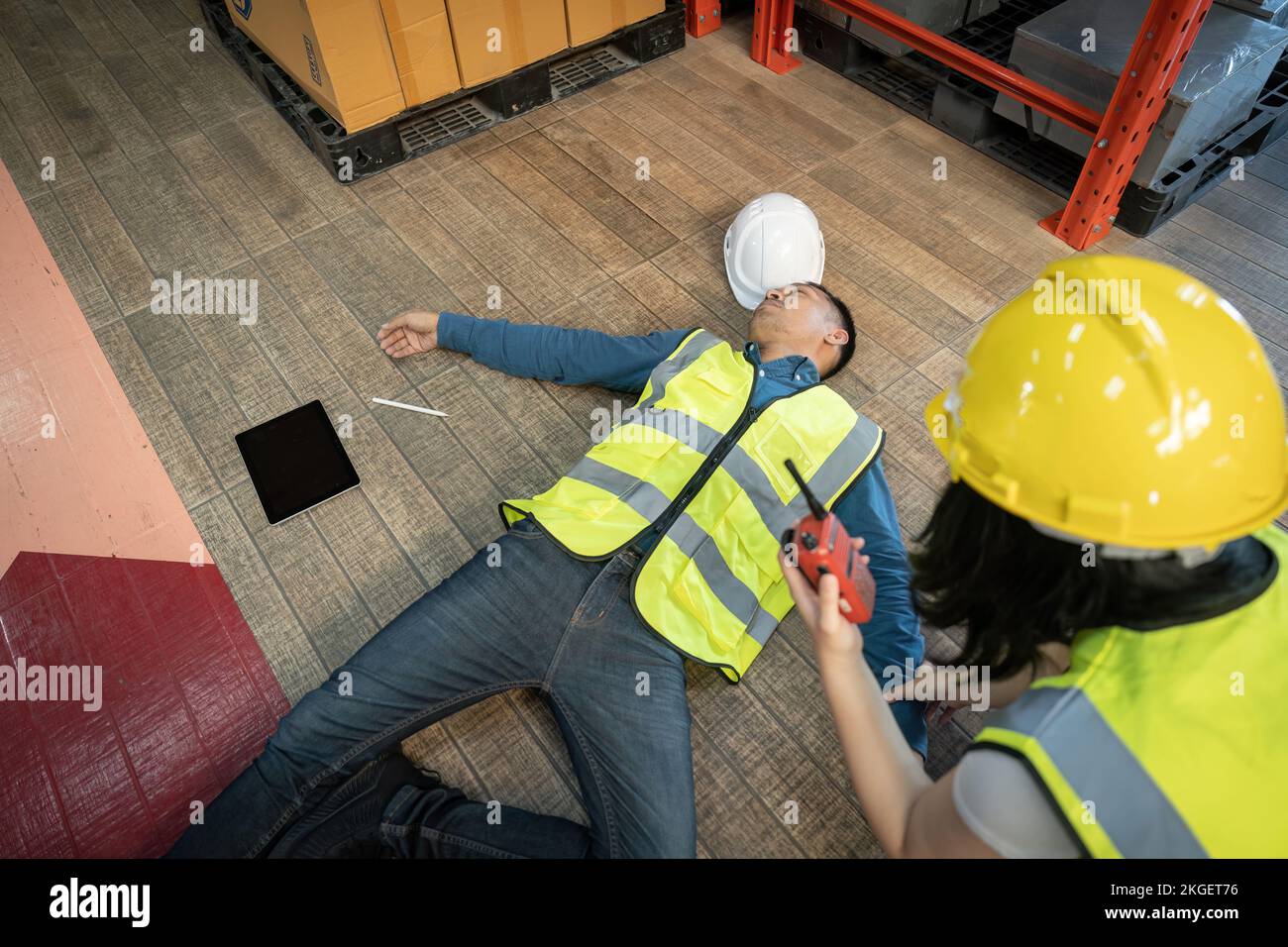 A female warehouse worker using a walkie-talkie called the factory's ...
