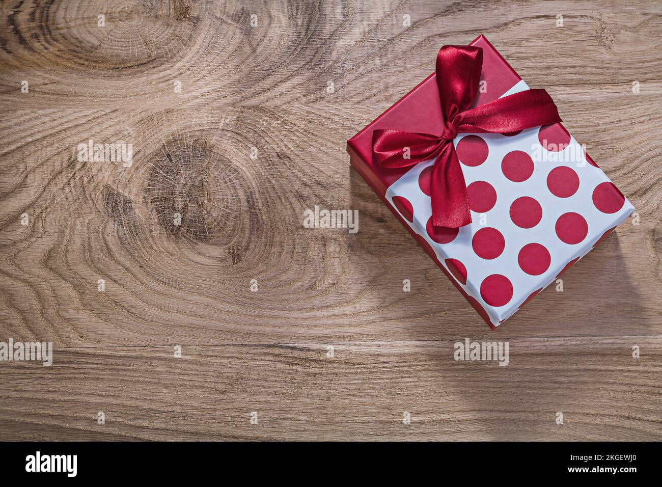 Red birthday present on wooden board celebrations concept Stock Photo ...