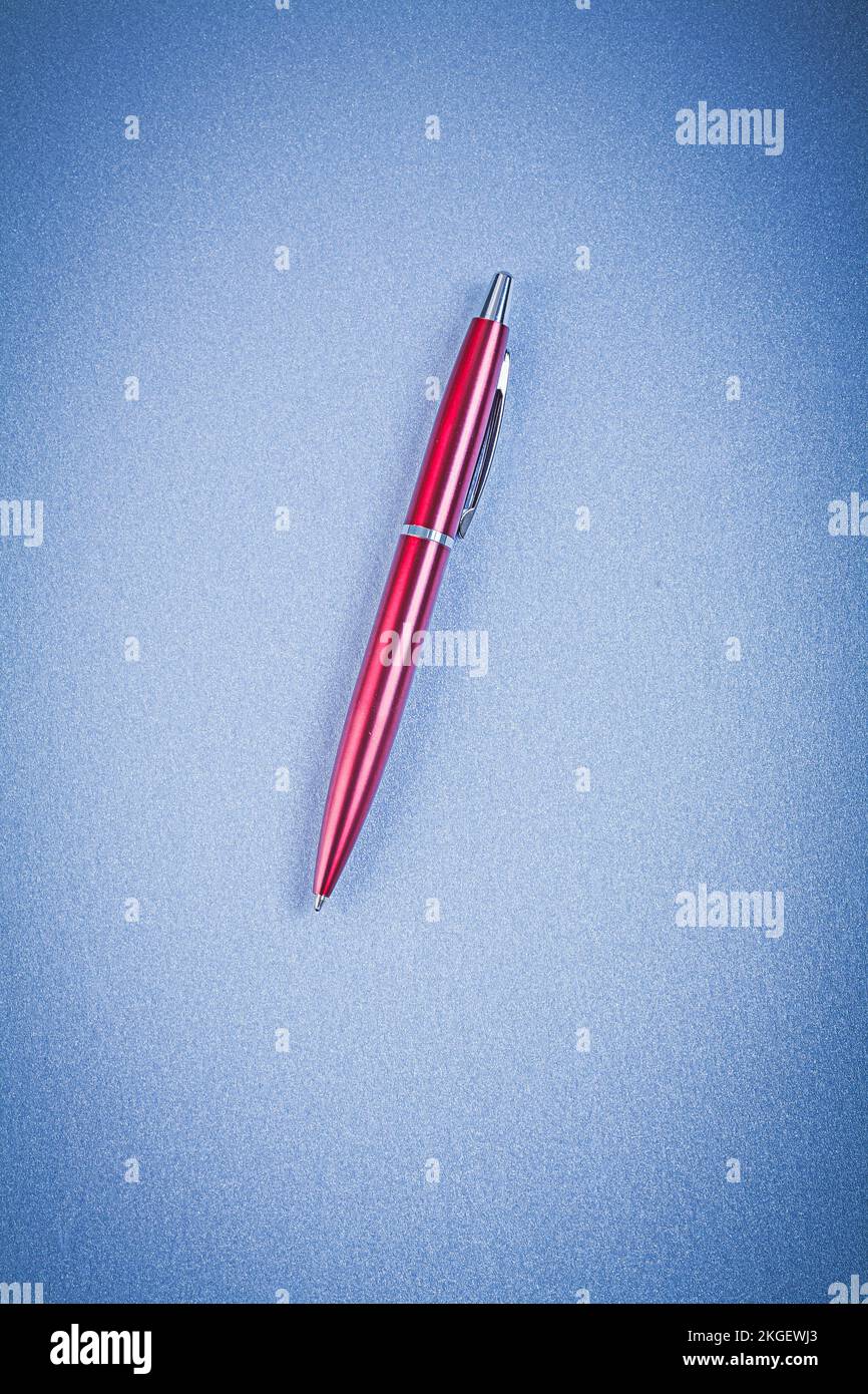 Red ball-point pen vertical version office concept Stock Photo - Alamy