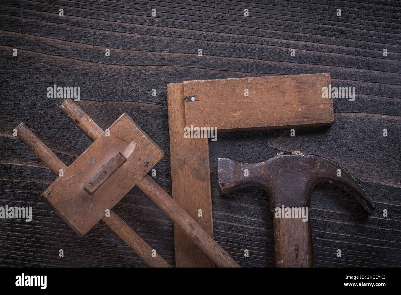 Retro-styled claw hammer square ruler surface gage on wood board Stock ...