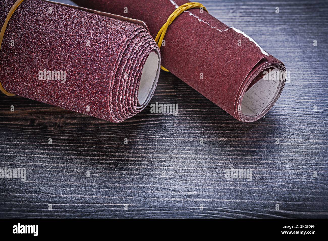 Rolled up glass-paper on vintage wooden board abrasive materials Stock ...