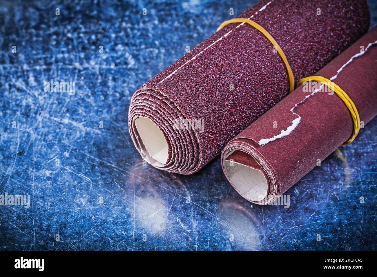 Rolls of emery paper on metallic background abrasive equipment Stock ...