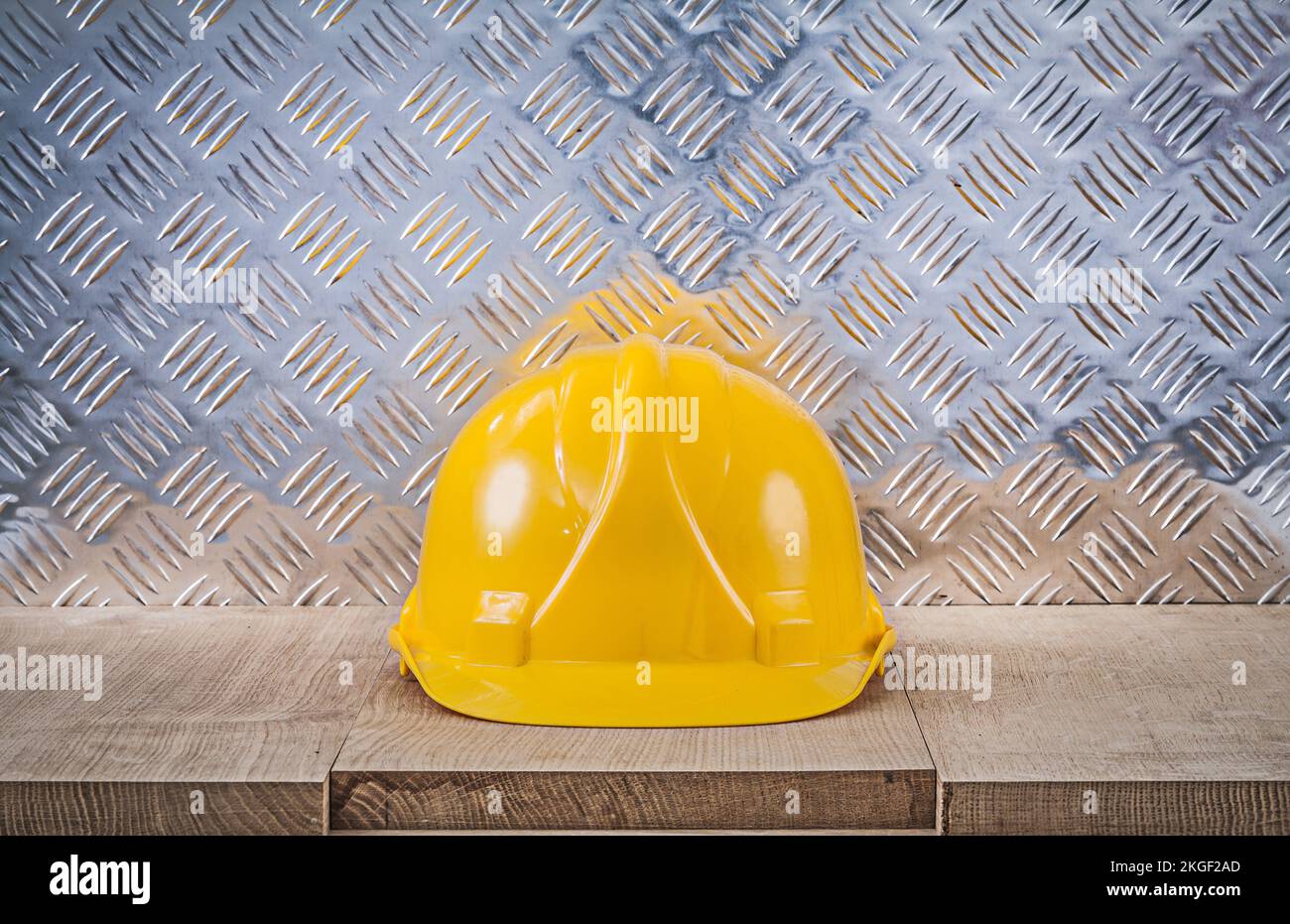 Safety hard hat wooden board channeled metal sheet construction concept ...