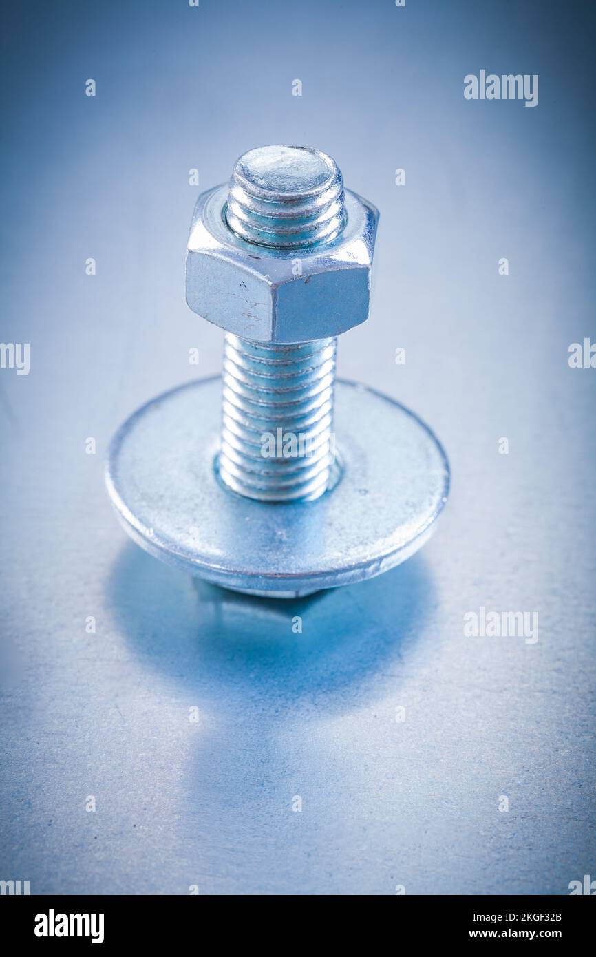 Screwbolt with bolt washer and construction nut on metallic background ...