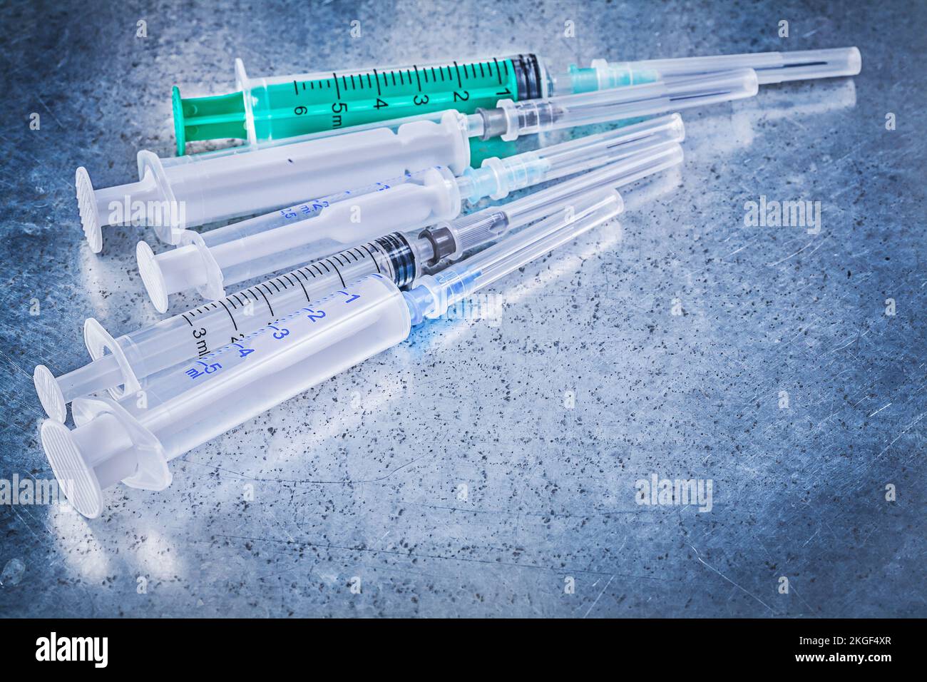 Set of medical disposable injectors on metallic background medicine ...